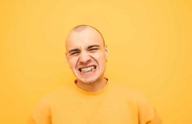 Permanent Gold Teeth Guide: Implants, Crowns, & Grillz - Dentaly.org